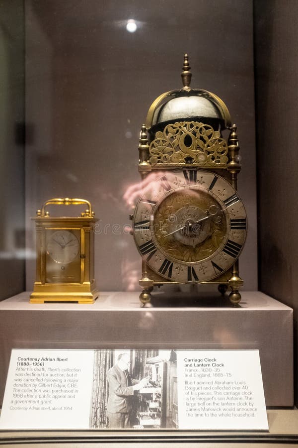 Rectangular, Gold-toned Carriage Clock, and an Ornate Lantern Clock ...