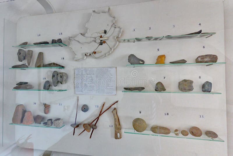 Museum Exposition with Numbered Tools of Ancient World Work Behind ...