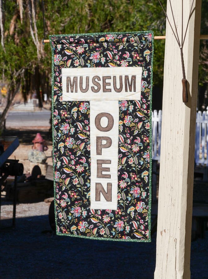 Cloth museum open sign stock image. Image of museum - 239545579