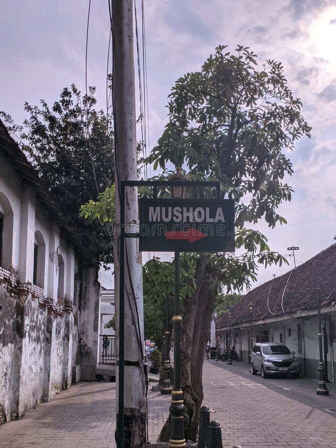Mushola Direction Sign on Old Town Street Stock Photo - Image of road ...