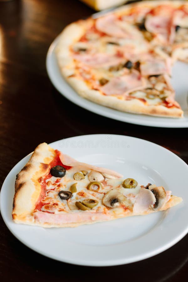Mushroom Pizza Slice on White Ceramic Plate Over the Table. Stock Image ...