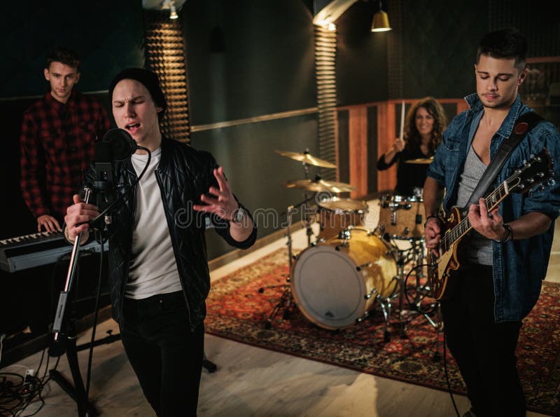 Music Band Having Rehearsal in a Studio Stock Image - Image of ...