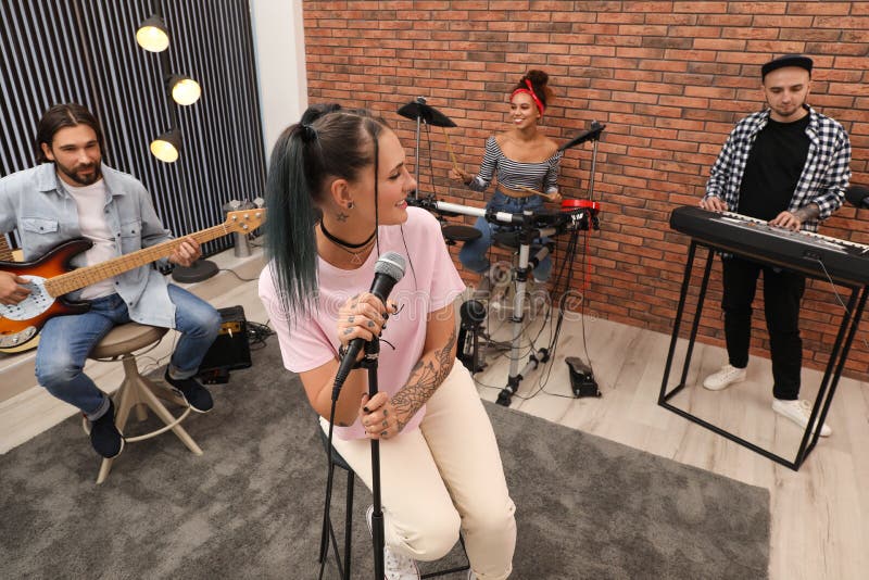 Music Band Performing in Modern Recording Studio Stock Image - Image of ...