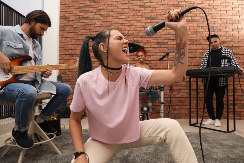 Music Band Performing in Modern Recording Studio Stock Photo - Image of ...