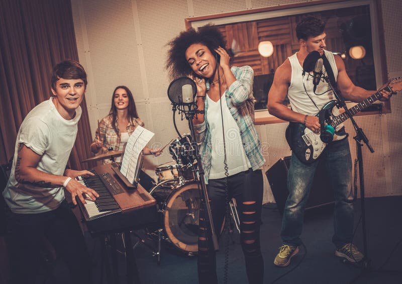 Music Band Performing in a Studio Stock Photo - Image of emotional ...