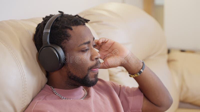 Music Fan African American Man Listening Music Sitting On Couch At Home