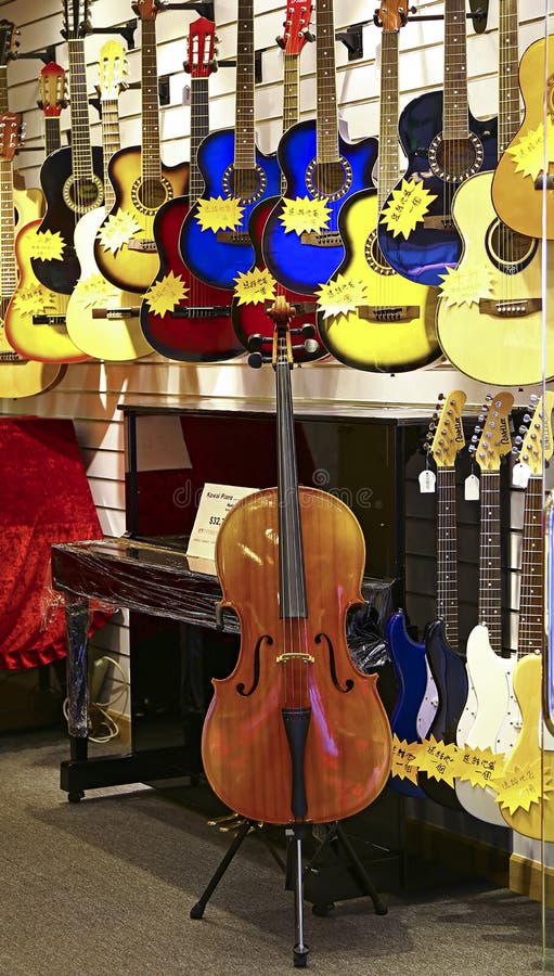 Music Instruments Store with Guitars, Piano, Cello Editorial Photo ...