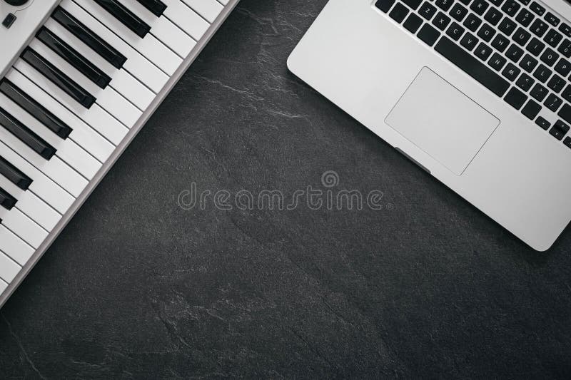 Music Keys and Laptop on a Textured Black Background, Flat Lay, Copy ...