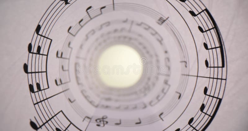 Music Sheet with Notes in Form of Roll Lit by Backlight Stock Video ...