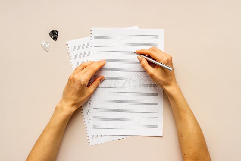 Music Sheets with Hands Writing Notes. Compose Music Concept Stock ...