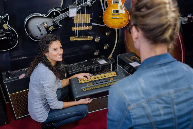 In the music shop stock image. Image of studio, business - 322657453