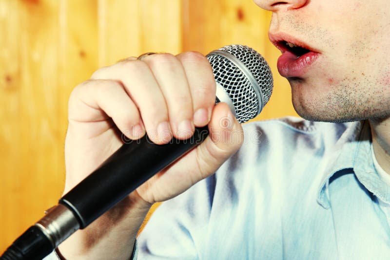 Holding Microphone stock image. Image of music, lead, singer - 231955