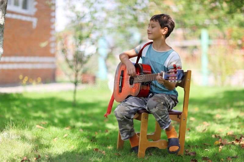 Music Student Playing the Guitar Stock Photo - Image of leisure ...
