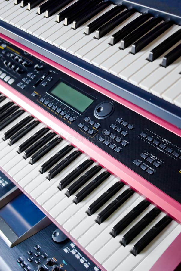 Music Synthesizer Keyboards on Rack Stock Photo - Image of board ...