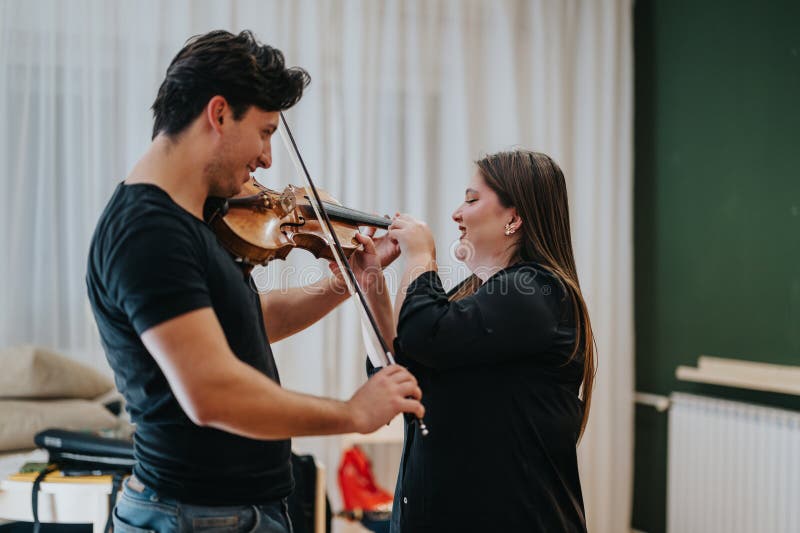 Music Instructor Teaching a Student Violin Techniques in a Cozy Studio ...