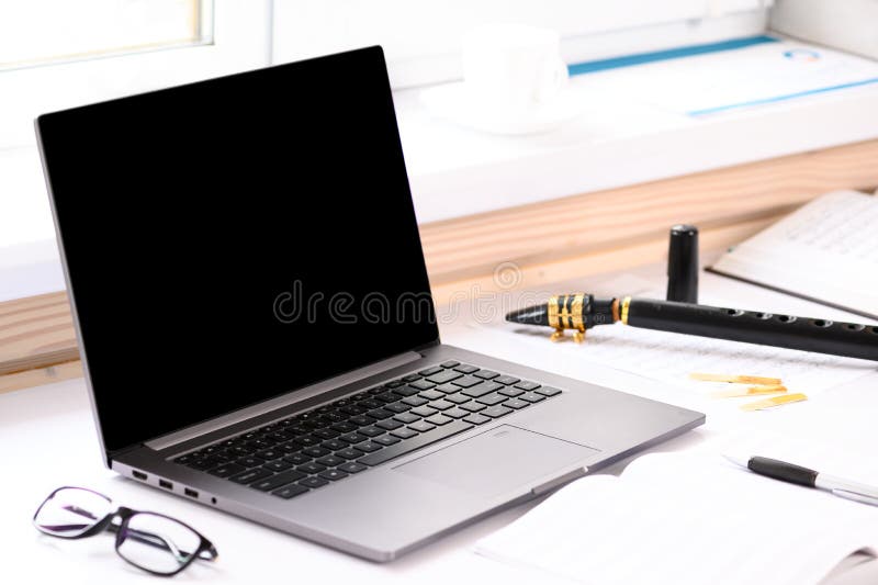 . Musical Instrument Playing Courses. on the Table There is a Laptop ...