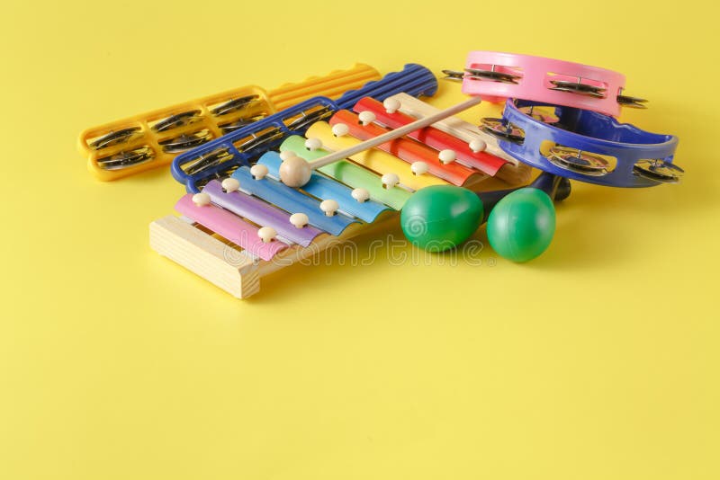 Musical Instruments Collection on Yellow Background Stock Photo - Image ...