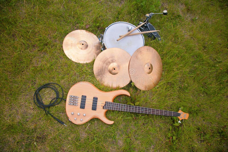 Musical Instruments, Guitar, Drum, Plates on Grass Stock Image - Image ...