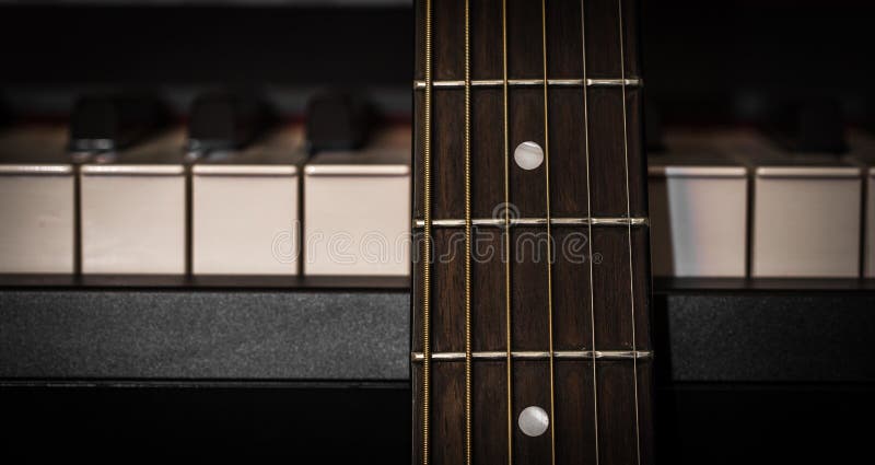Musical Instruments Piano Keys and Acoustic Guitar Stock Photo - Image ...