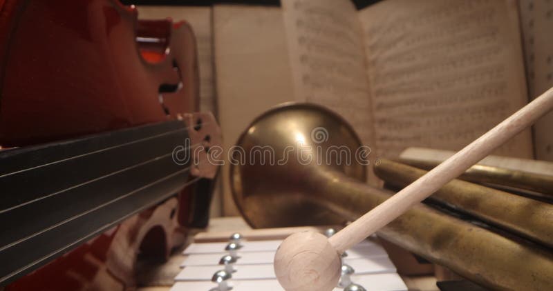 Musical Instruments with Sheet Music on Table Stock Footage - Video of ...