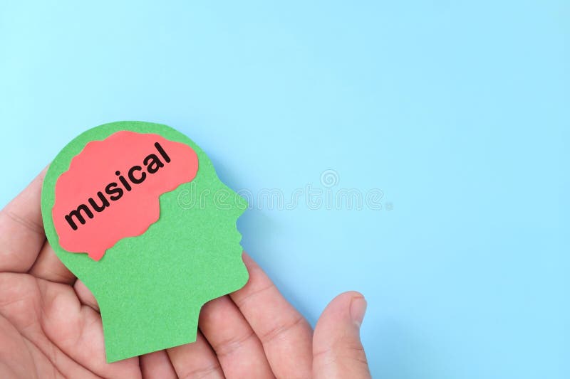 Musical Intelligence in Psychology Concept. Hand Holding Human Head ...