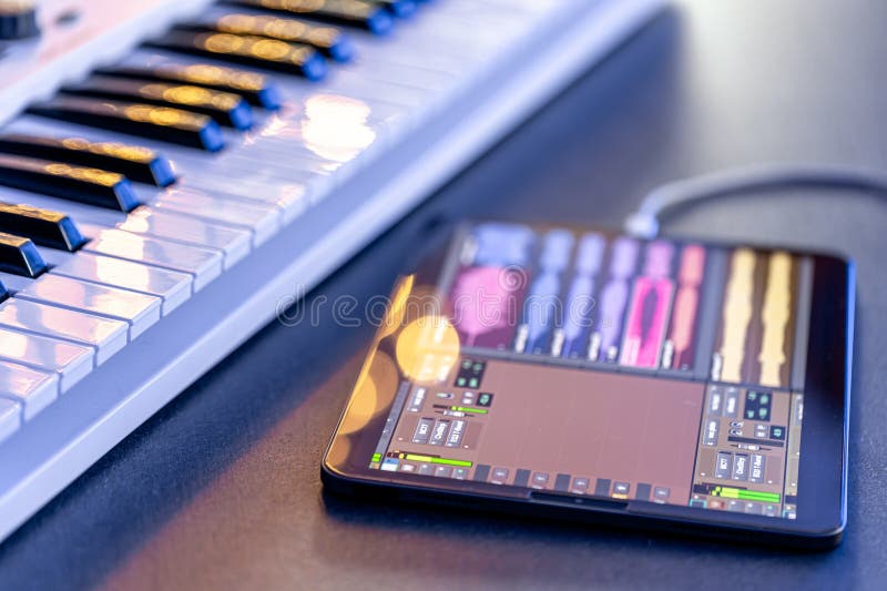 Musical Keys and a Tablet with a Stylus on the Table. Stock Image ...