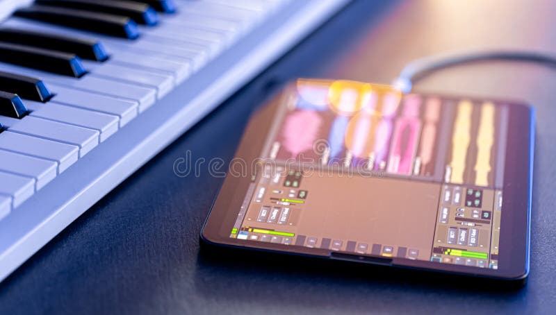 Musical Keys and a Tablet with a Stylus on the Table. Stock Photo ...