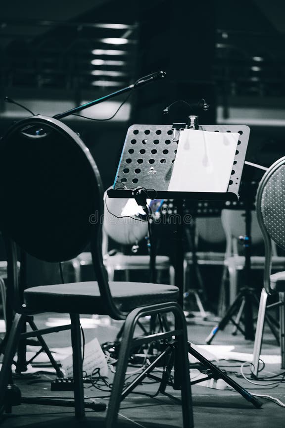 Musical Music Stand on Stage. Scattered Sheets of Music on Floor Stock ...