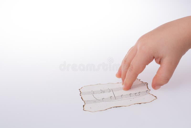 Musical Notes on Burnt Paper in Hand Stock Photo - Image of bass ...