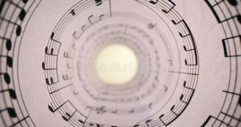 Musical Notes Printed on a Sheet of Paper Rolled into a Tube Stock ...