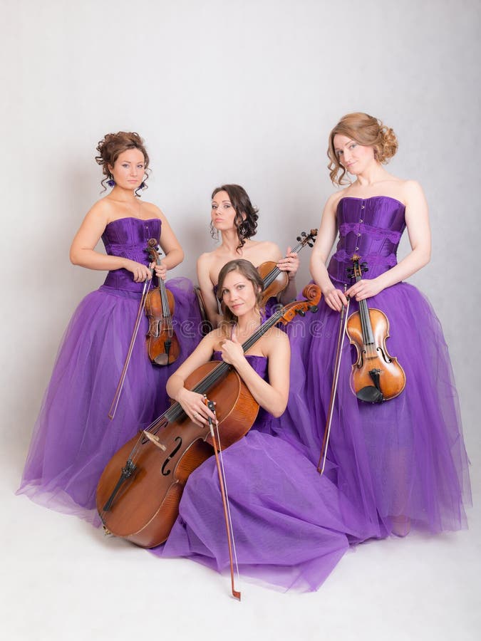 Musical Quartet in Evening Dresses Stock Photo - Image of adults ...