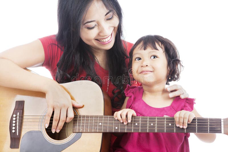 Musician with her daughter stock photo. Image of hispanic - 26594502