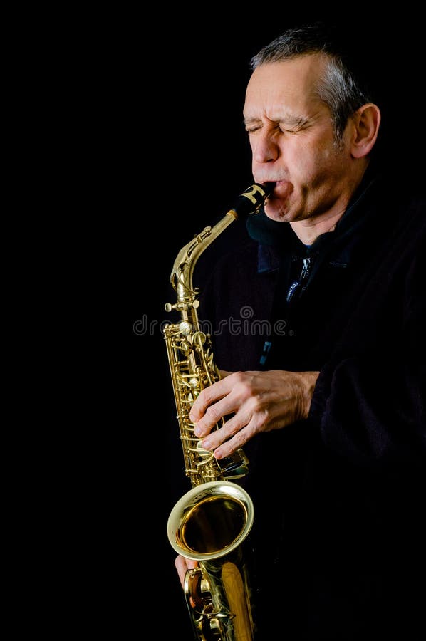 Jazz man plays a saxophone stock photo. Image of joyful - 17407836