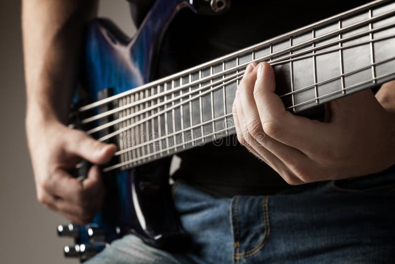 Musician Playing on Six-string Bass Guitar Stock Photo - Image of hand ...
