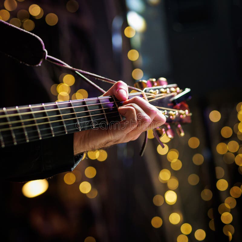 A Musician Plays a Chord on an Acoustic Guitar during a Performance ...