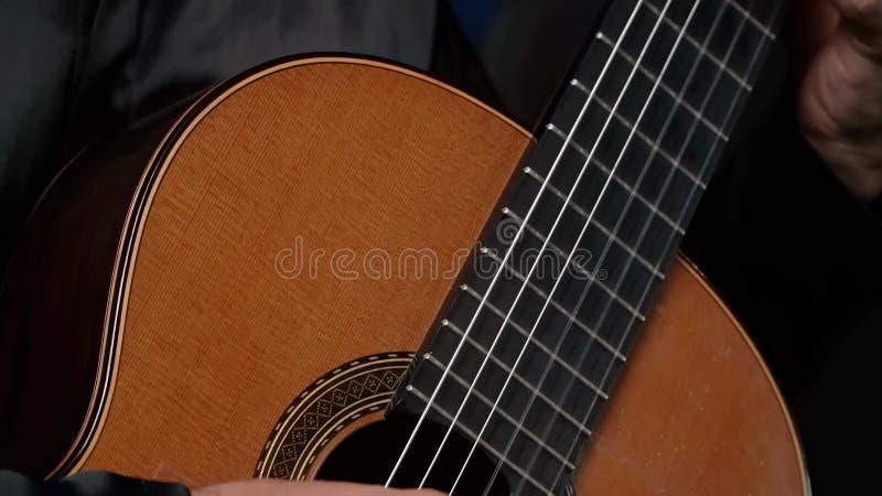 Musician Playing Classical Guitar with Microphone for Recording Session ...