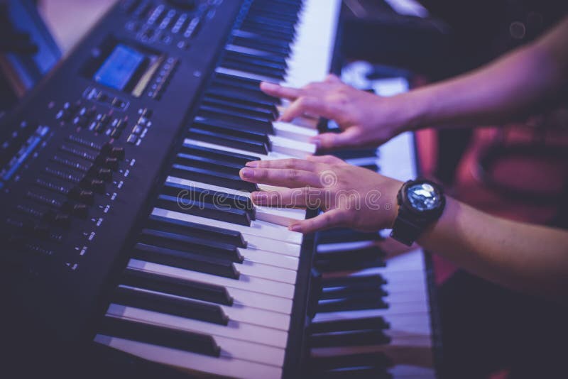 Man Playing On Synthesizer Keyboard On Stage During Concert Stock Photo ...