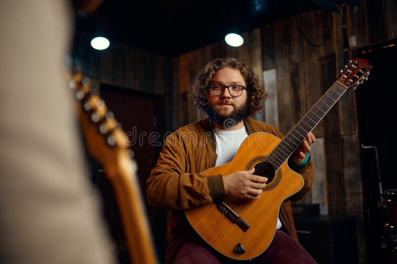 Music Tutor Explaining Features of Playing Guitar Stock Photo - Image ...