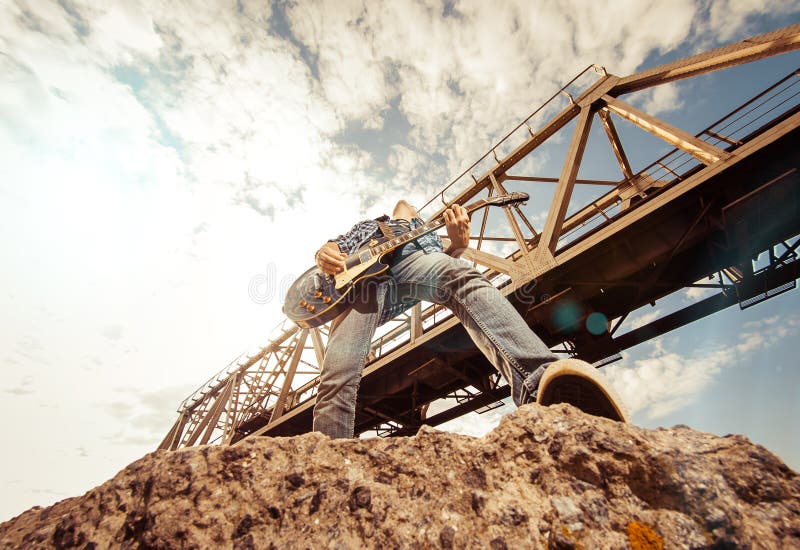 Musician under bridge stock photo. Image of music, rails - 26721778