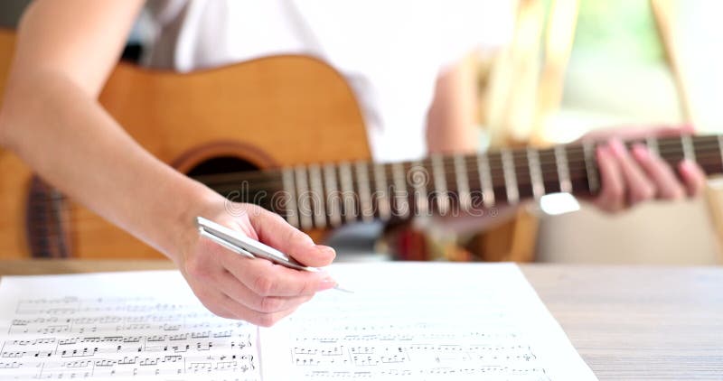 Musician Writes Musical Notes Texts. Guitarist Playing Guitar Stock ...