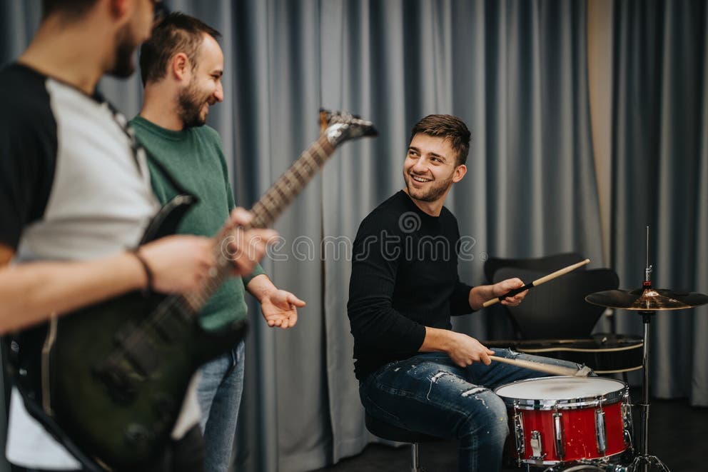 Musicians Collaborating while Practicing Together in a Studio Setting ...