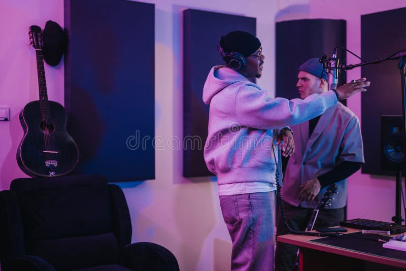 Musicians Collaborating in a Professional Recording Studio with Vibrant Lighting Stock Image ...