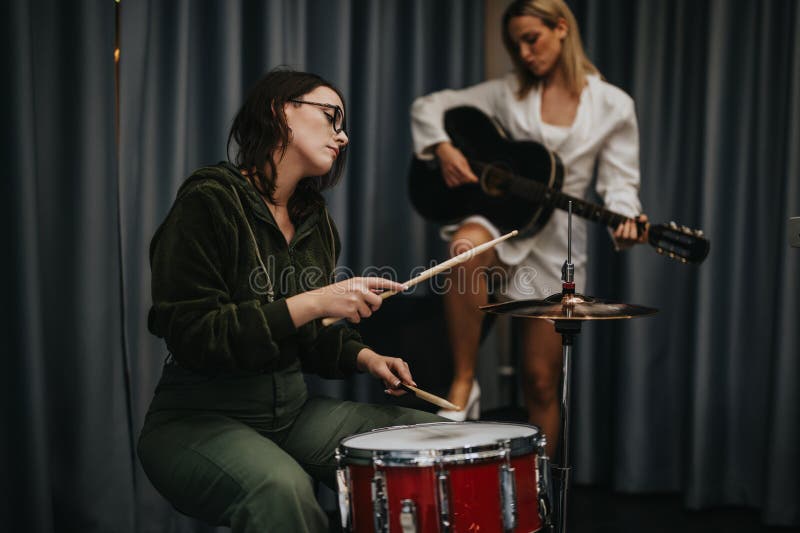 Two Musicians Performing Music with Drums and Acoustic Guitar in a ...