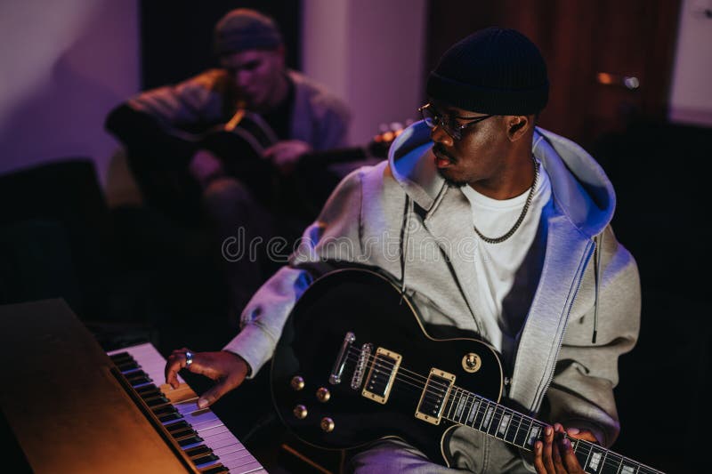 Musicians Jamming in Studio with Electric Guitar and Electronic ...