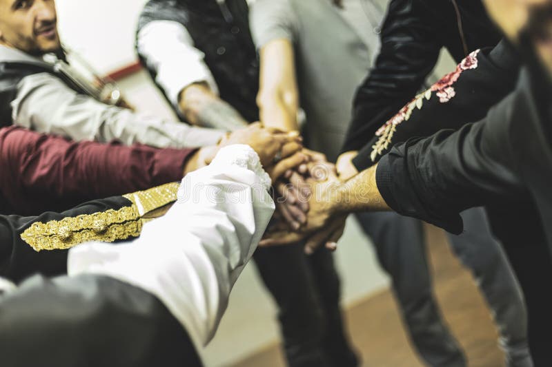 Band Members Showing Unity by Joining Hands before Concert Stock ...