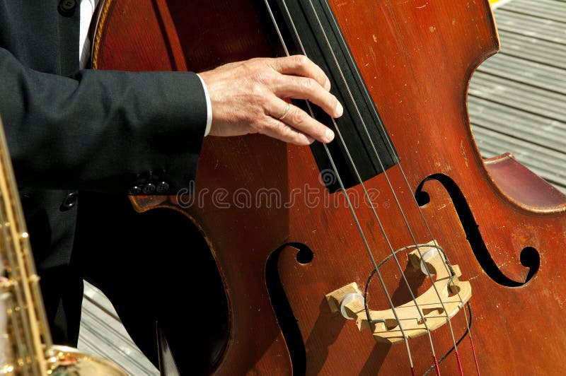 Musicians Playing Instruments in the Sun Stock Photo - Image of bass ...