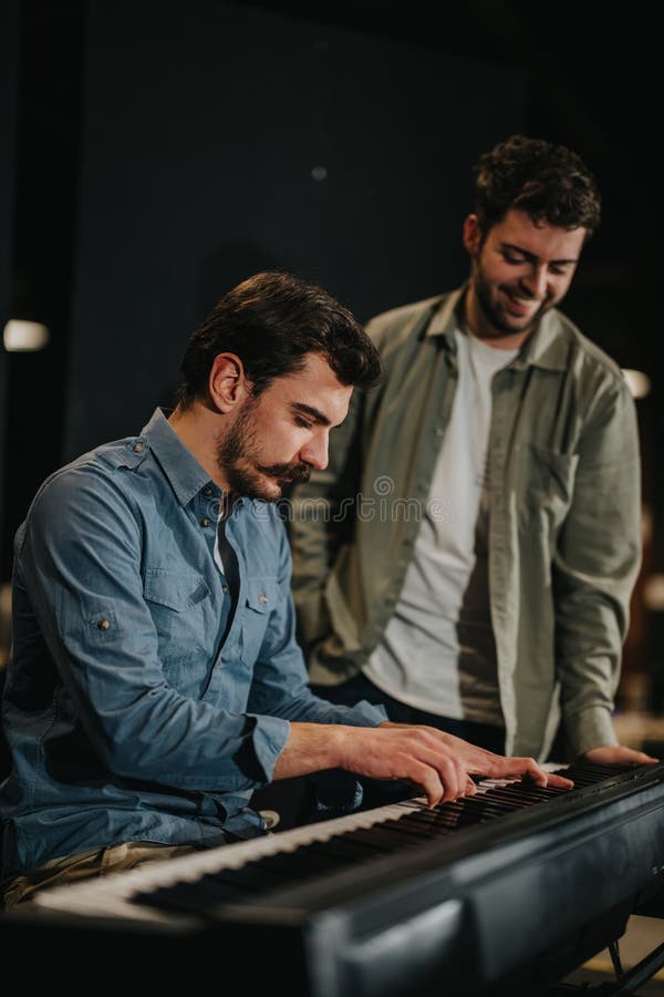 Musicians Practicing Piano Together while Enjoying Collaborative ...