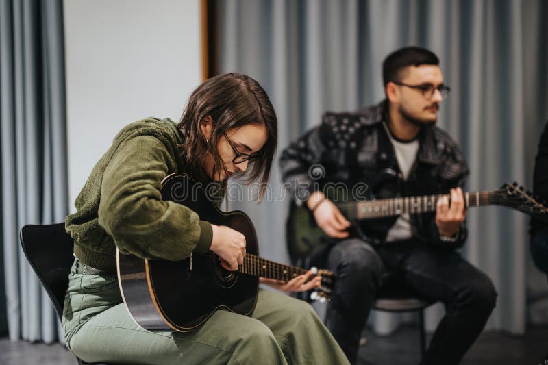 Two Musicians Rehearsing on Acoustic and Electric Guitars in a Music ...