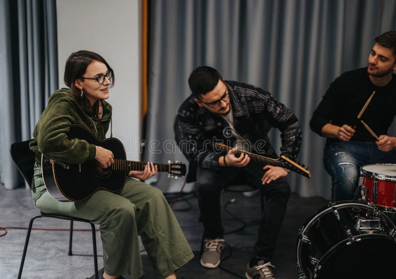 Musicians Rehearsing in a Studio Exchanging Ideas and Perfecting Their ...