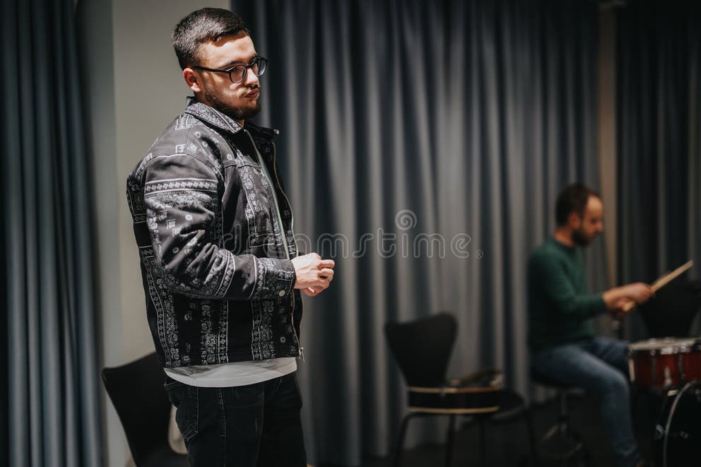 Musicians Rehearsing in a Studio Space, Preparing for a Musical ...